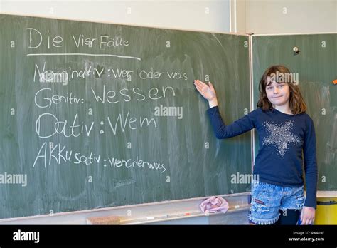 Girl At Blackboard In German Class Elementary School Germany Stock