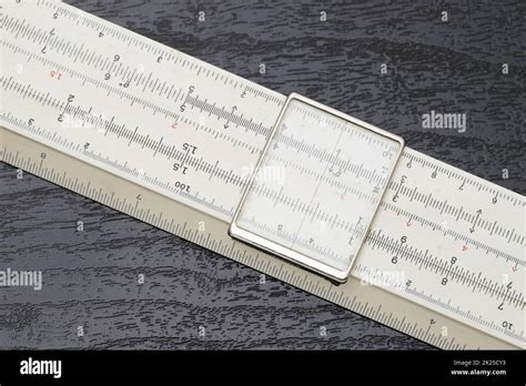 Close Up Of Old Slide Rule On Black Background Stock Photo Alamy