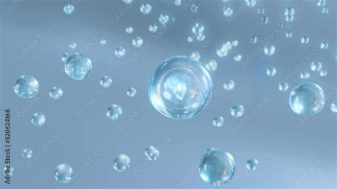 A Macro Shot Of Various Water Bubbles Rising Against A Light Blue