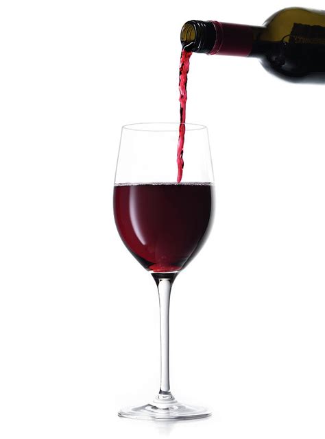 Red Wine Being Poured Into Wine Glass By Ts Photography