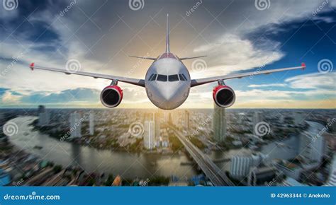 The Passenger Airplane Is Flying Far Away In The Dark Clouds Aircraft