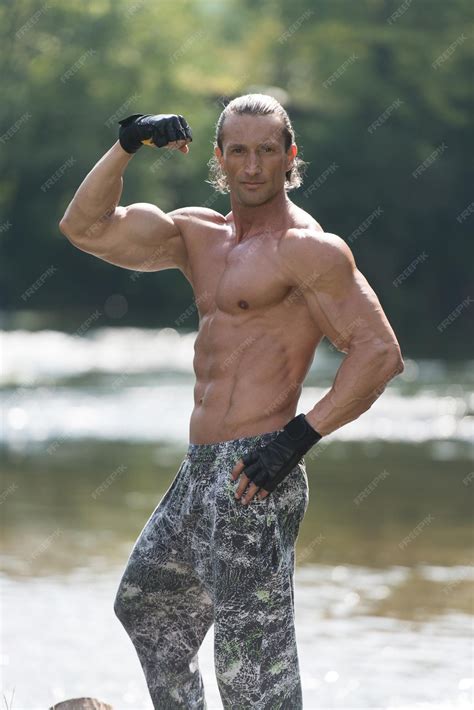 Premium Photo Handsome Mature Man Standing Strong Outdoors In Nature