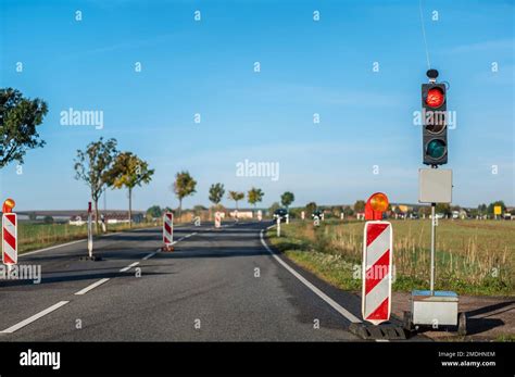 Modern Construction Site Traffic Light With Motion Detector In Front Of