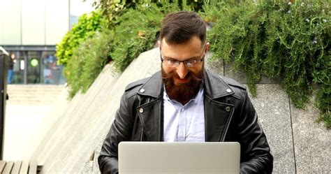Premium Photo Bearded Businessman Working On Laptop Computer