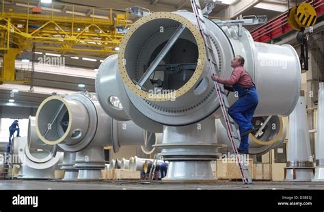 Dpa A Enercon Employee Is Climbing Up A Windmill Boss On A Ladder
