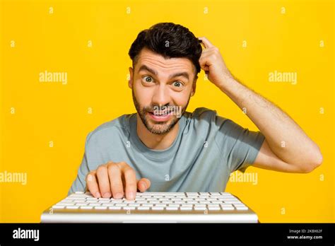 Closeup Photo Of Young Smart Programmer Sitting Looking Monitor Typing