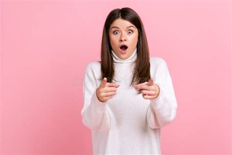Extremely Astonished Female Pointing At Camera Being Very Shocked To