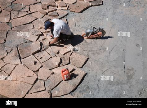 Man Laying Limestone Slabs On A Terrace Stock Photo Alamy