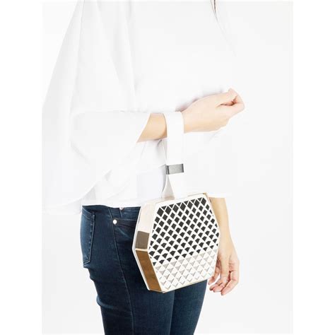 Buy Devina Juneja Angular Story Hexagon Cutwork Wristlet In White And Black Online