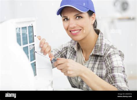 Woman Installing New Ac System Stock Photo Alamy