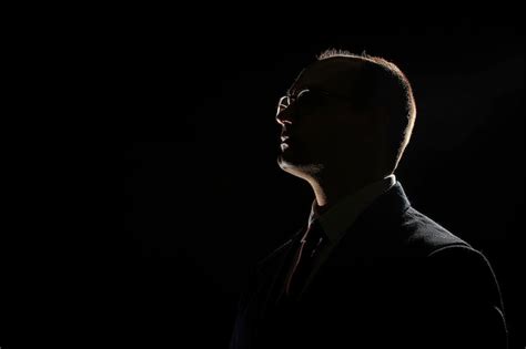 Premium Photo Silhouette Of Businessman In The Dark Photo