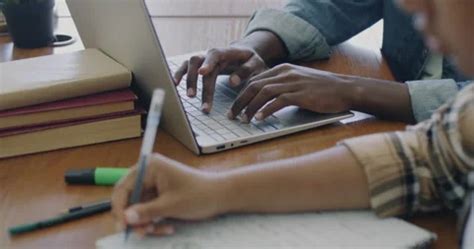 Close Up Of Hands Male And Female Writin Stock Video Pond