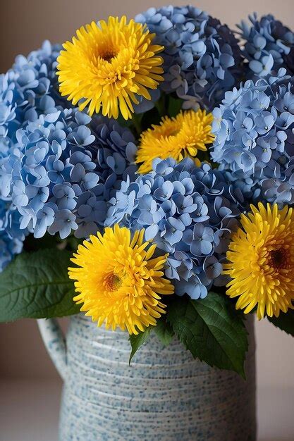 Premium Photo Bouquet From Blue Hydrangeas And Yellow Asters A Flower Background