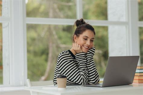Premium Photo Happy Smiling Girl Doing Work Using Laptop At Home