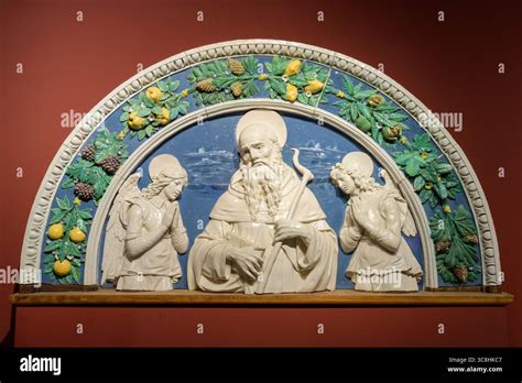 Glazed Terracotta Lunette Of Saint Anthony Abbot With Two Praying