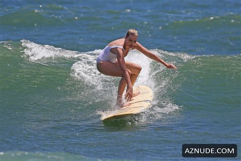 Margot Robbie Sexy In A White One Piece Swimsuit Surfing In Hawaii AZNude