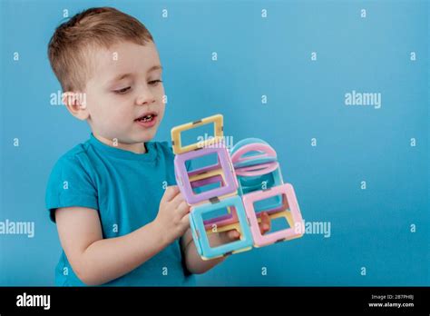 Boy Looks Through The Shape In The Color Constructor With The