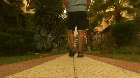 Man Walking Down Path HD 4K Stock Footage 285973
