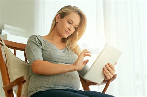 Typing Online And Woman With Tablet Pregnant And Planning For Birth