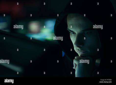 Young Professional Hacker Working In A Dark Office With Computers Cyber Security And Hacking