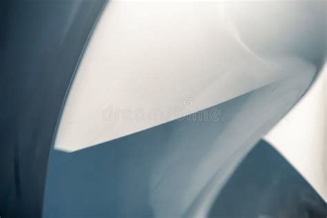 Blue And Gray Abstract Background From Curved Lines Of Geometric Shapes