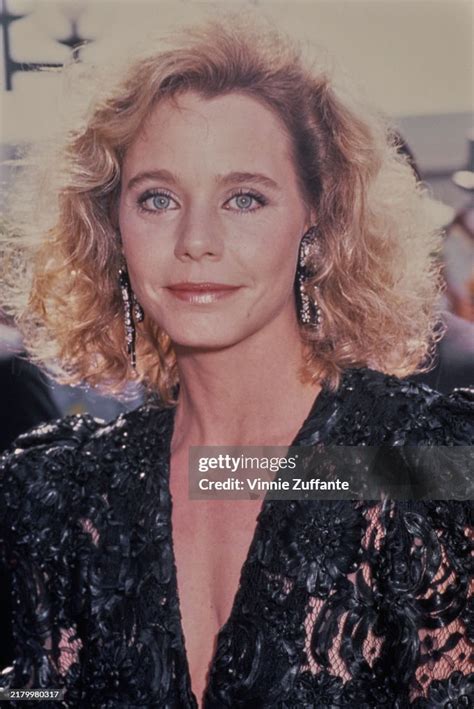 American Actress Susan Dey Wearing A Black Lace Outfit Attends The