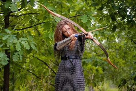 Medieval Warrior Woman In Chain Mail And Bracers With A Bow In Her
