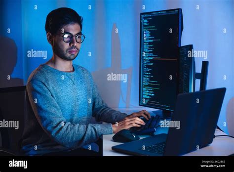 indian software development working on coding computer screen and