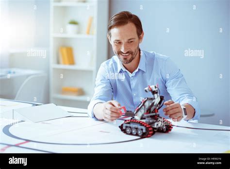 Positive Engineer Testing Robot Stock Photo Alamy