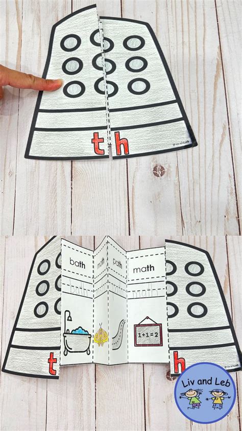 A Hand Holding An Open Book On Top Of A Wooden Table