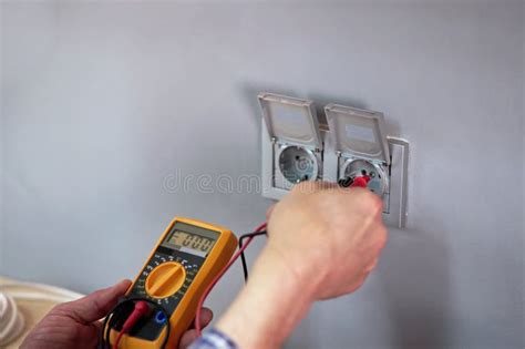 Male Electrician Checking Voltage Of Socket With Multimeter Stock Image Image Of Test Wiring
