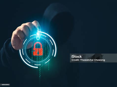 Hacker Is Pointing His Finger At A Binary Code On A Dark Background