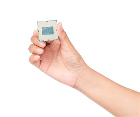 Premium Photo Hand Holding Cpu Computer Isolated On White Background