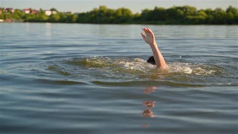 Bearded Man Is Drowning In A Lake And Desperately Trying To Stay Afloat