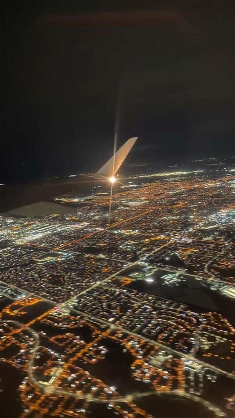 City At Night Aerial View With Airplane Lights