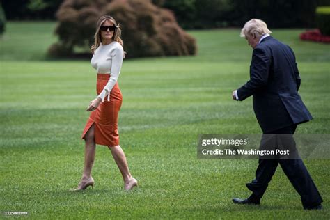 President Donald Trump And First Lady Melania Trump Walk Across The