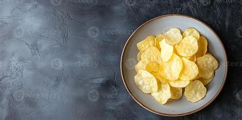 Serving Of Potato Chips In A Flat Wide Rimmed Plate With Visible Surface Details Food