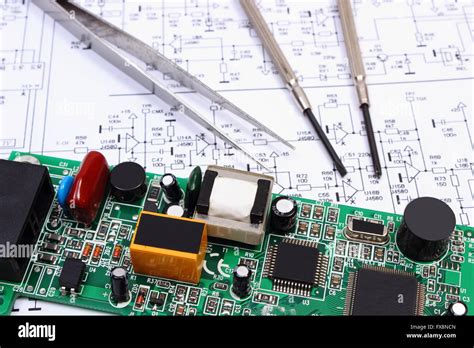 Printed Circuit Board With Electrical Components And Precision Tools Lying On Construction
