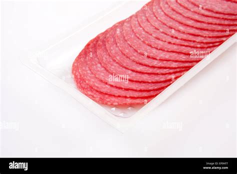 Sliced Salami On The Package Isolated Over White Background Stock