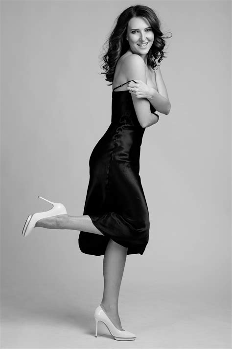 A Woman In Black Blazer And High Heels Posing For A Photoshoot · Free