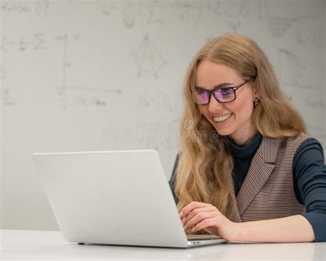 Caucasian Woman Scientist Typing On Laptop White Board With Formulas