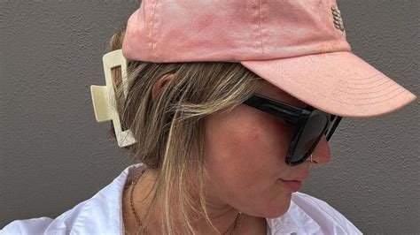 The Viral Hack That Shows How To Clip Your Hair Up While Wearing A