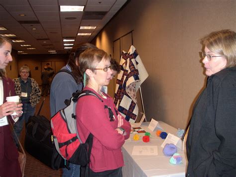 People At The Exhibit Including Barbara Hamilton On The Left And