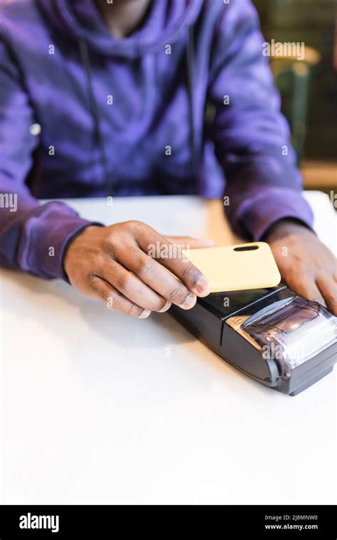 High Angle Of Crop Anonymous African American Male Client Using Nfc