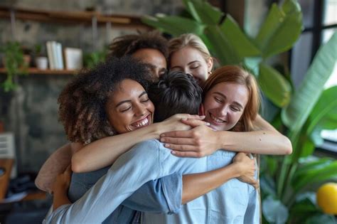 Premium Ai Image Embracing Unity A Diverse Group Of Friends Sharing A Supportive Group Hug In