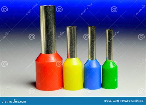 Four Colorful Ferrules Standing In A Row On A White Background With A