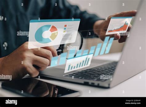 Businesspeople Working On A Monitor Graph Dashboard While Performing