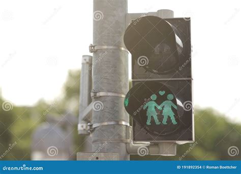 A Pedestrian Traffic Light Shows A Green Graphic Of A Loving Same Sex Lesbian Women Couple In
