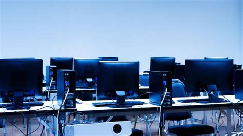 Premium Photo Computer And Monitor Row In Computer Class