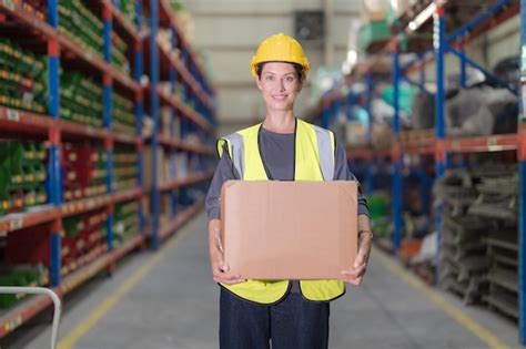 Premium Photo A Female Worker Sorting Goods In A Warehouse